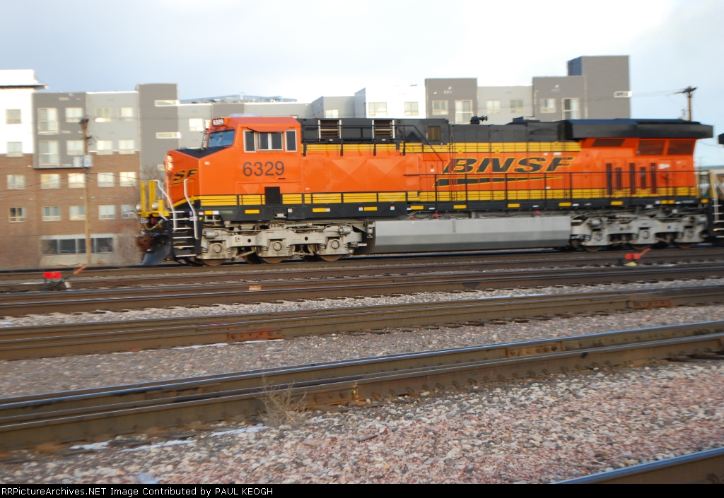 BNSF 6329 leads a loaded coal train south.